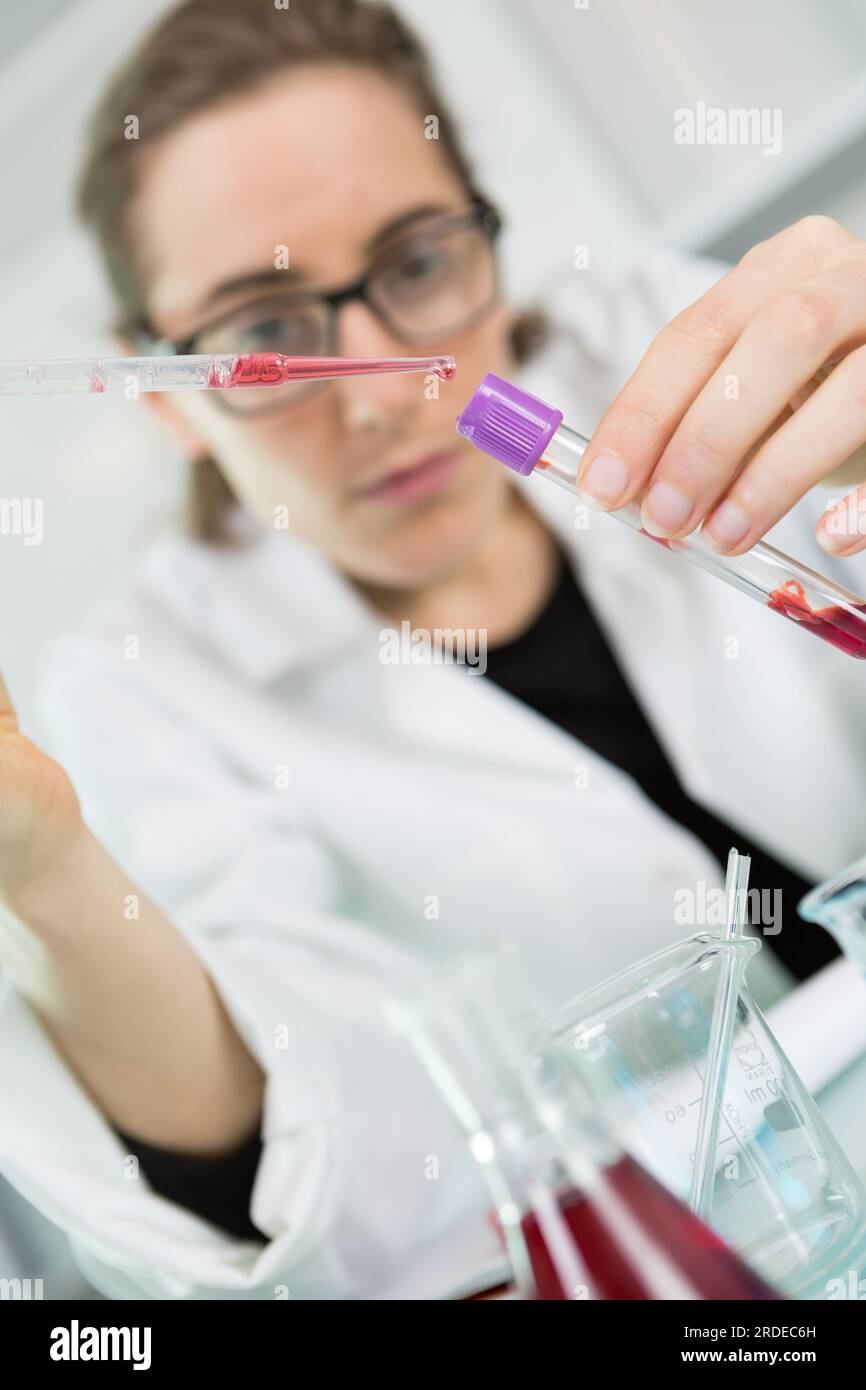 Dropping liquid laboratory glassware hi-res stock photography and ...