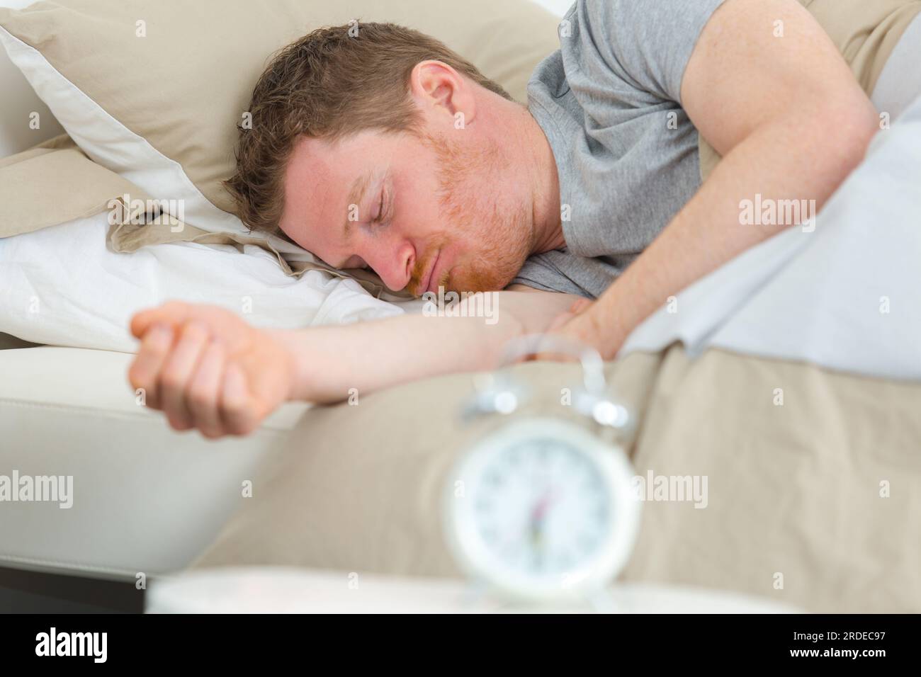 handsome man sleeping in his bedroom Stock Photo - Alamy