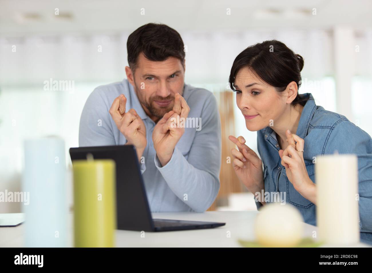 Woman fingers crossed laptop hi-res stock photography and images - Alamy