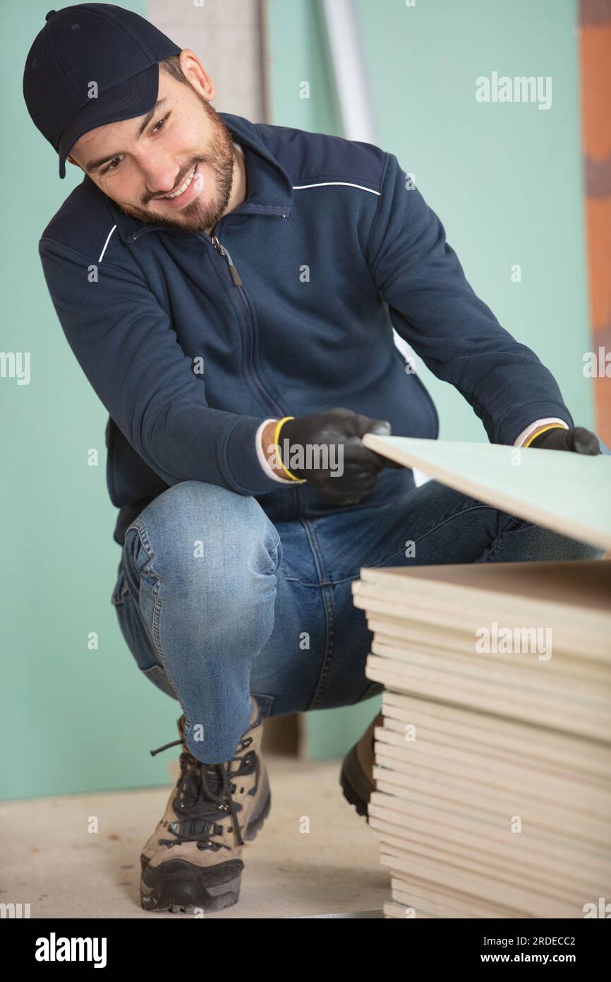 construction worker positioning timber wall panels Stock Photo - Alamy