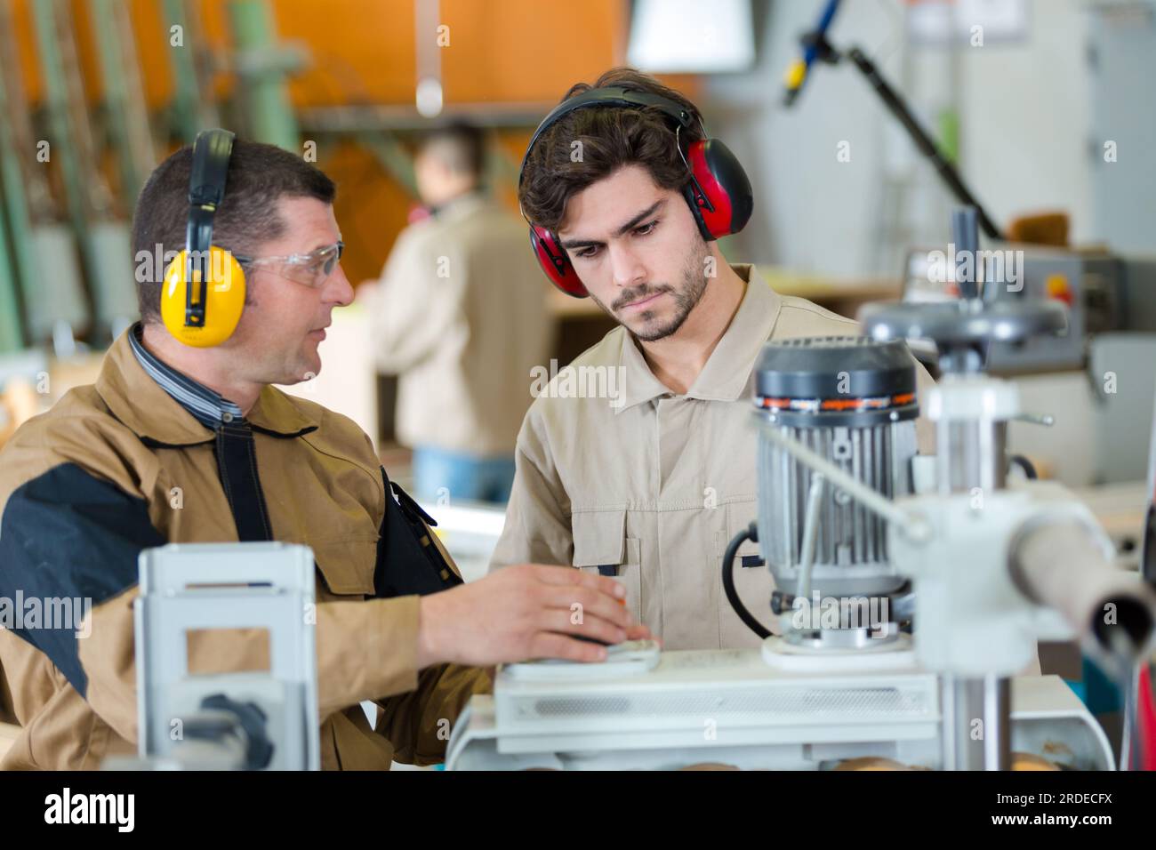 giving instructions to a future industrial technician Stock Photo - Alamy