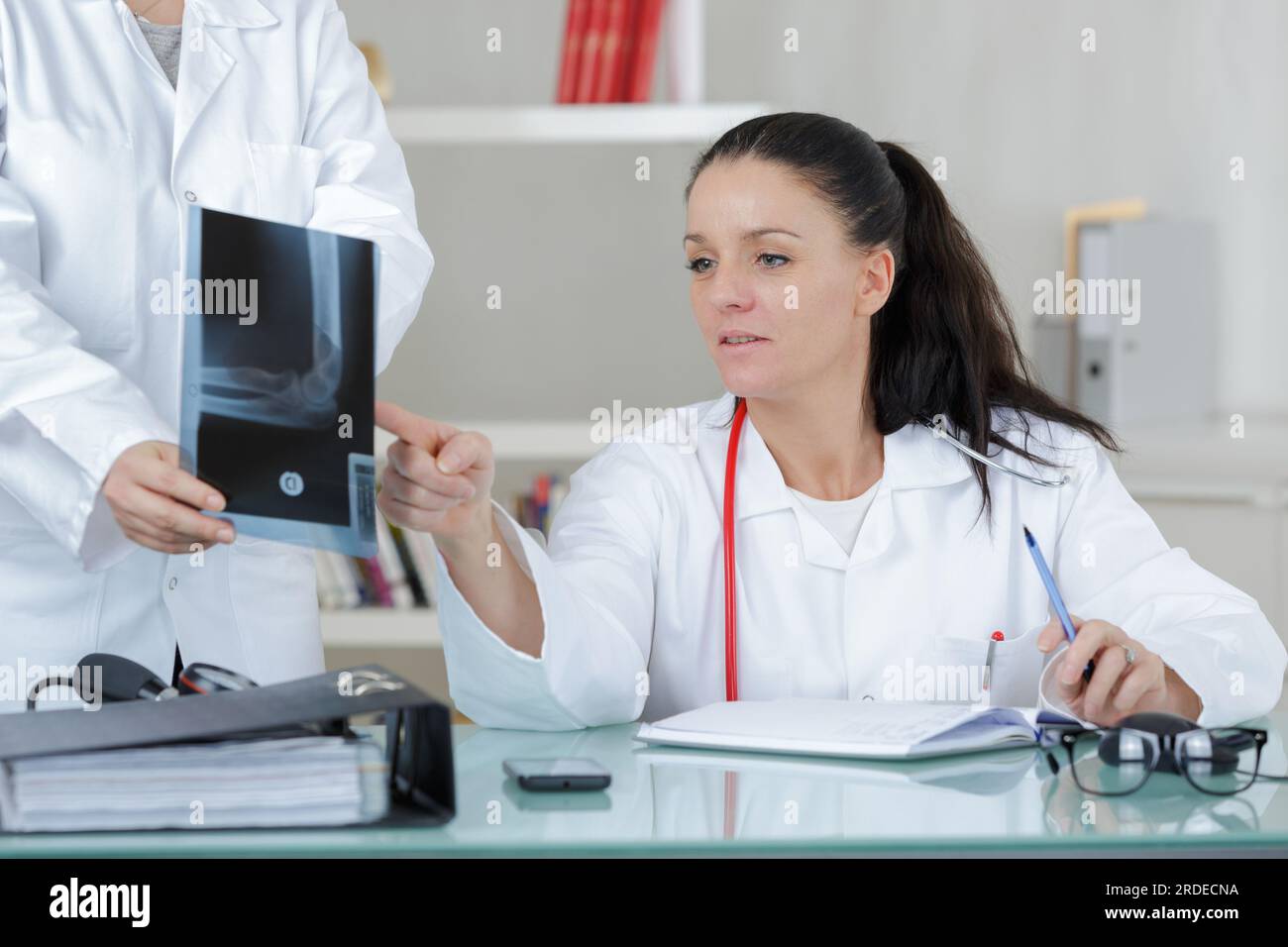 she is verifying the image result Stock Photo - Alamy