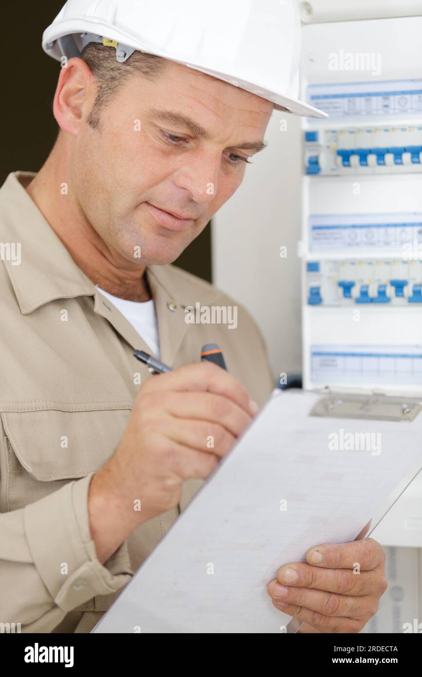 male electrician checking industrial machine control Stock Photo - Alamy