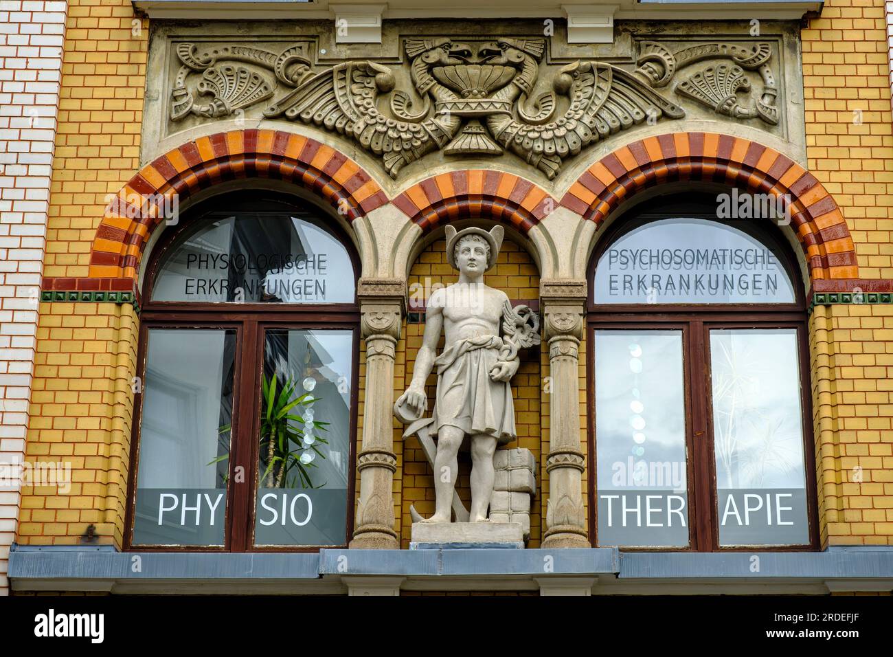 Statue of Hermes or Mercury, messenger of the gods, in a window niche ...