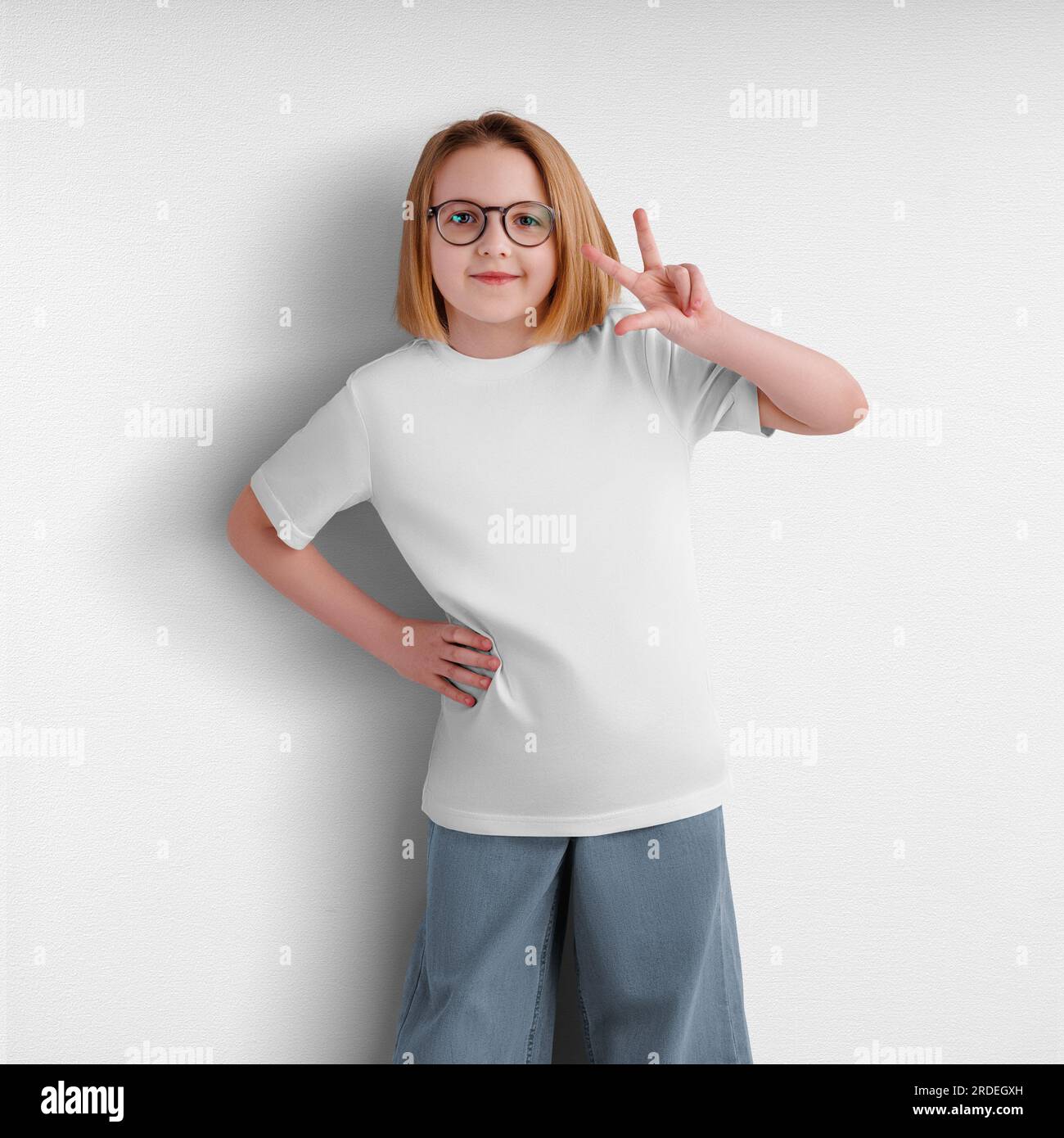 Template of a white kid shirt, a t-shirt on a cheerful girl, wear for a ...