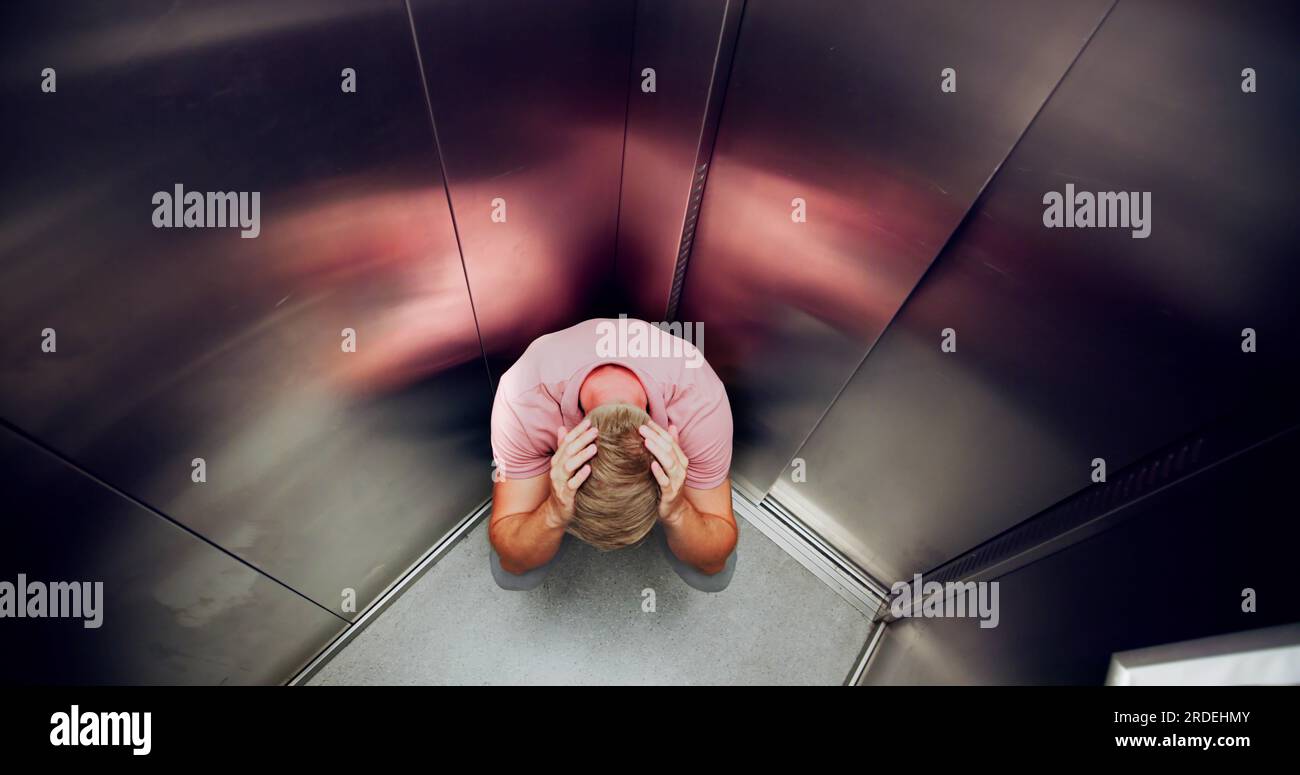 Man Suffering From Claustrophobia Trapped Inside Elevator Screaming ...