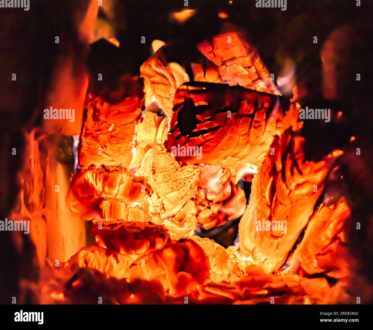 Beautiful old fireplace with light flame fire for heating building room ...