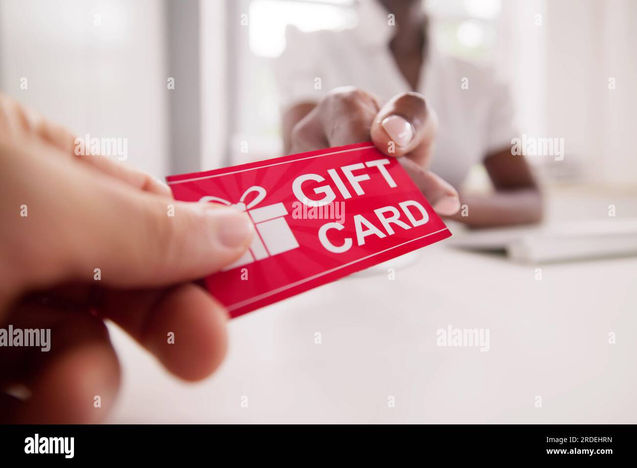 Holding Giving Gift Card Voucher And Ticket Stock Photo - Alamy
