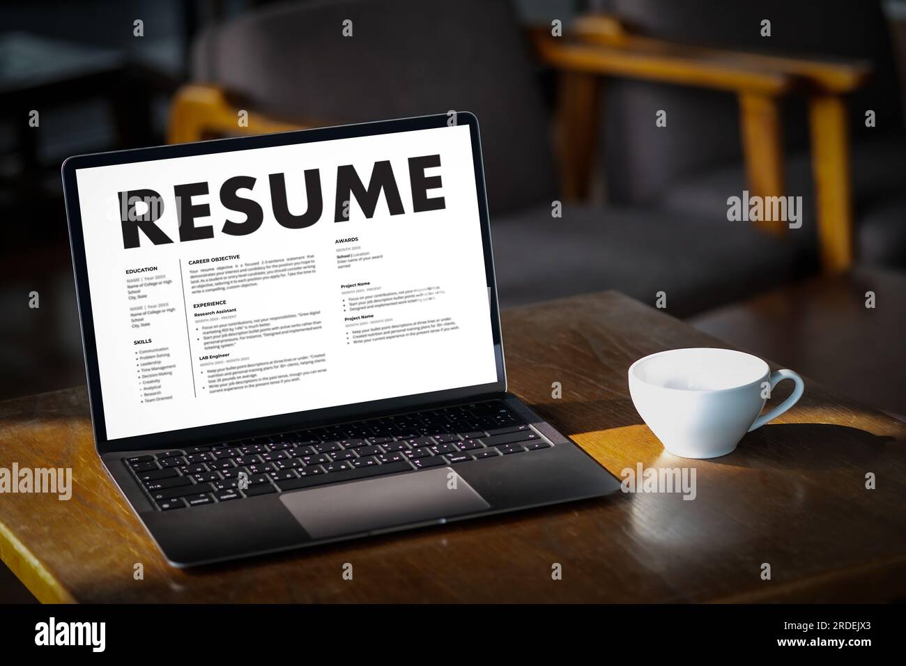Businessmen Reading Resumes for a new job use laptops and CVs in the ...