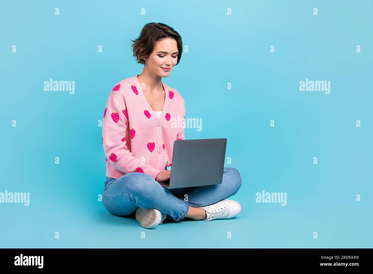 Full body photo of cute young woman bob brown hair sit floor using new ...
