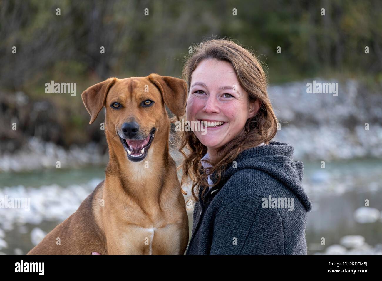 Laughing animal, young woman with her dog, intimate relationship, love ...