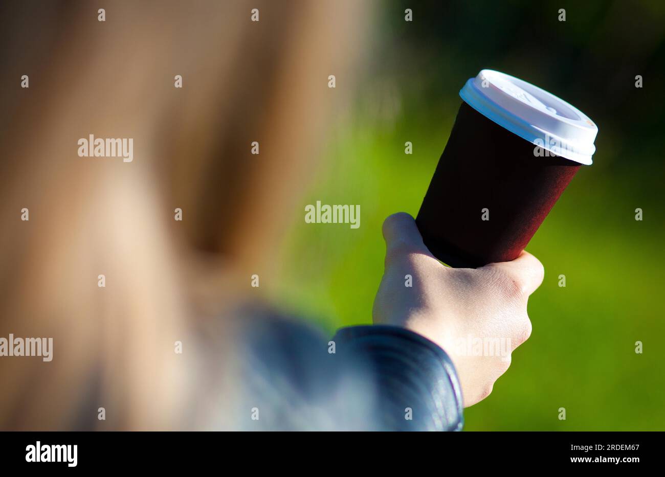 Cup in hand hi-res stock photography and images - Alamy