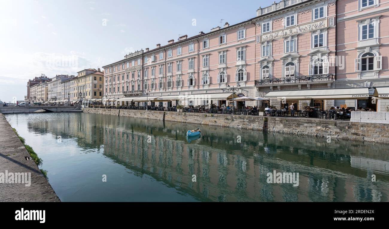 TRIESTE, ITALY - may 29 2023: cityscape with people enjoying Spritz ...