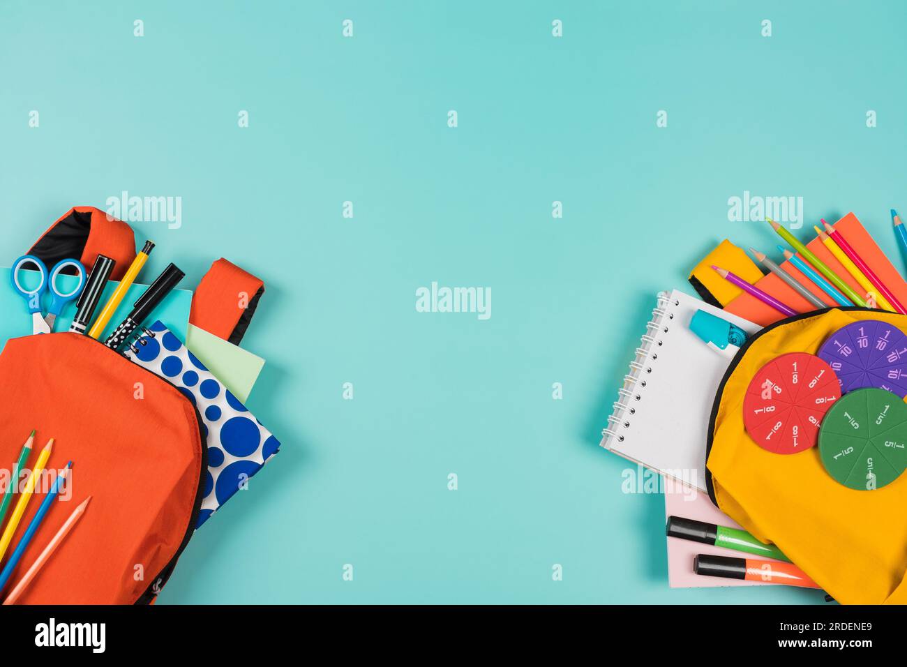 Back to school, education, learning concept. Two open backpacks with ...