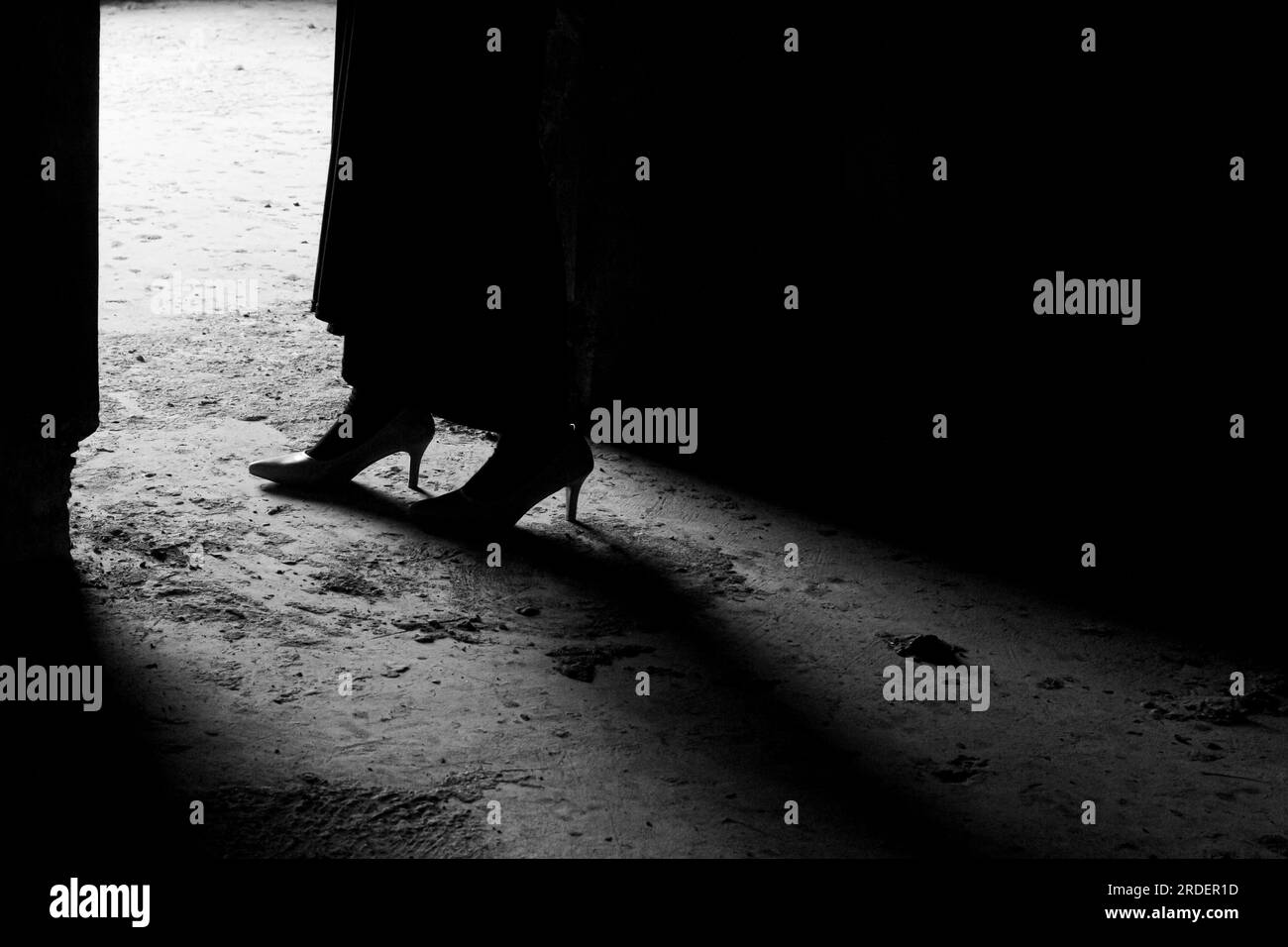 Black and white silhouette and shadow of woman wearing dress ...