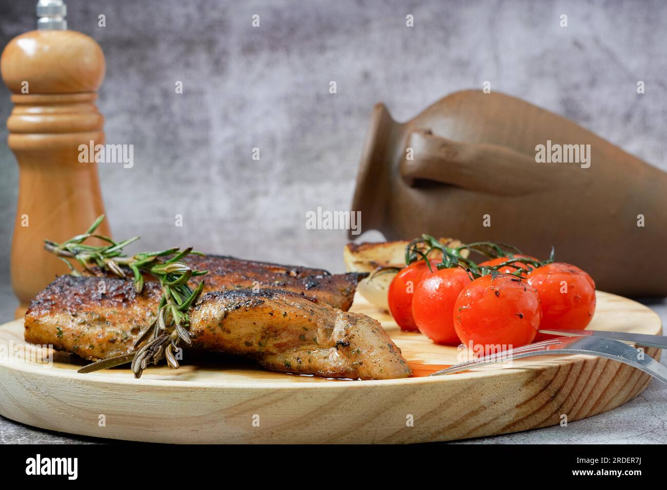 Roasted iberian secreto iberico with cherry tomato, roasted onion ...