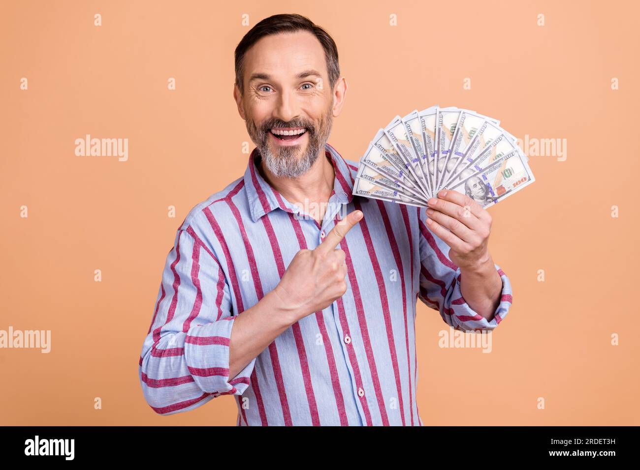 Photo of positive successful man toothy smile direct finger hand hold ...