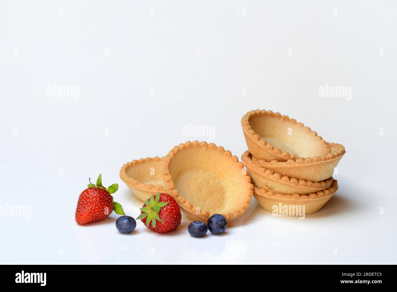 Tartelette, pre-made tartlet base with strawberry and blueberry Stock ...