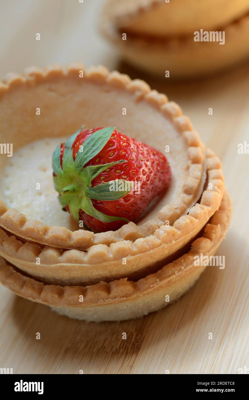 Tartelette, pre-made tartlet base with strawberry Stock Photo - Alamy