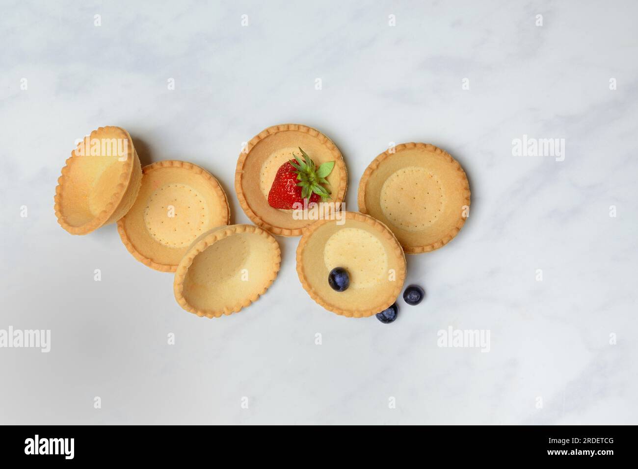 Tartelette, pre-made tartlet base with strawberry and blueberry Stock ...
