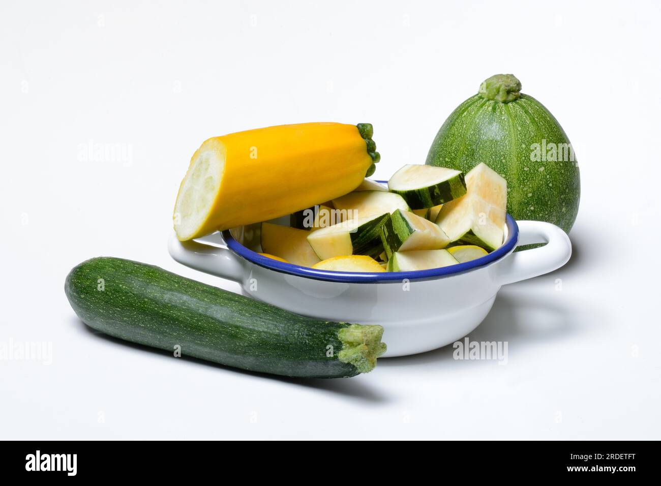 Various courgettes (Cucurbita pepo), courgettes cut up in pot convar ...