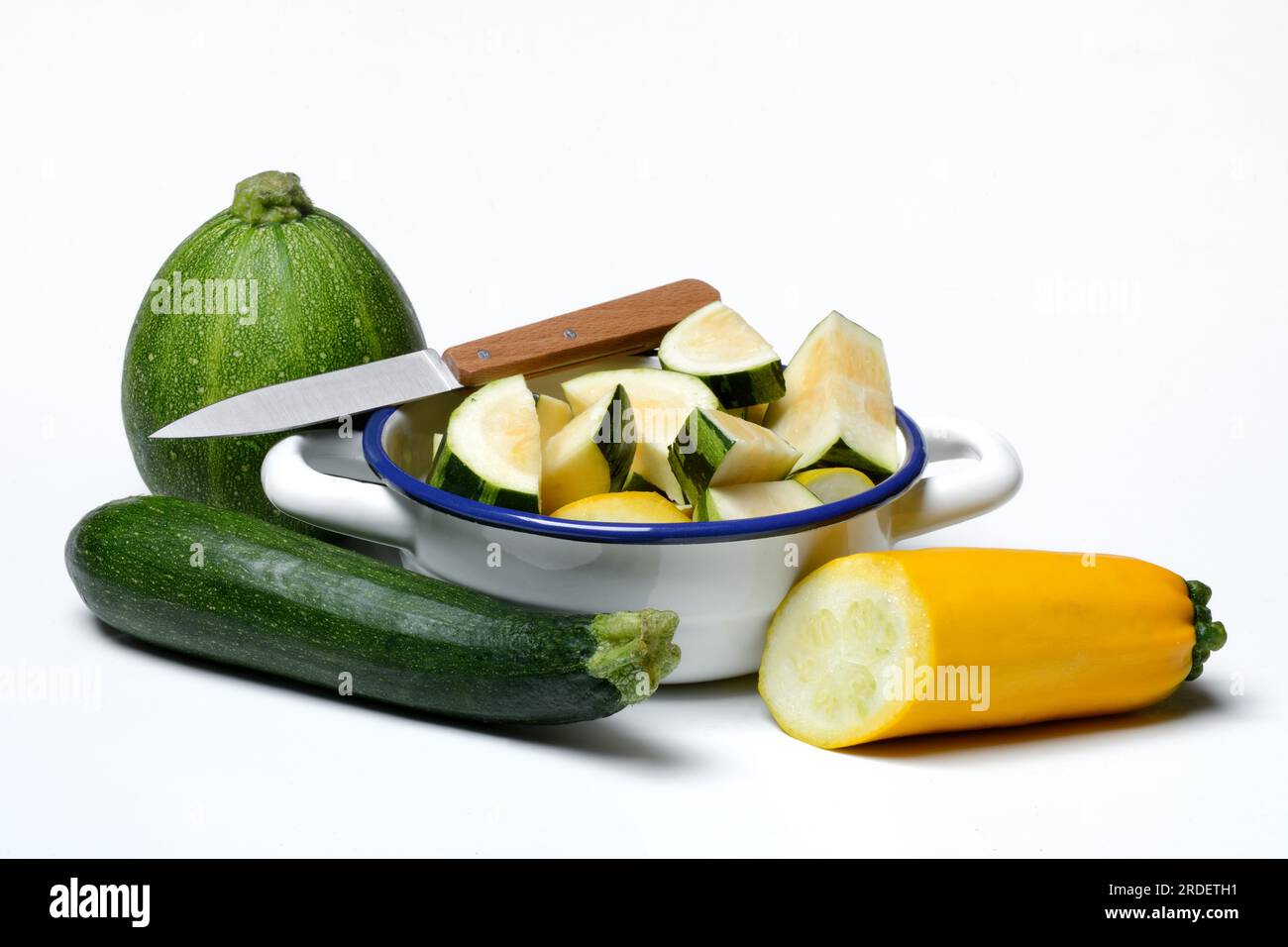 Various courgettes (Cucurbita pepo), courgettes cut up in pot convar ...