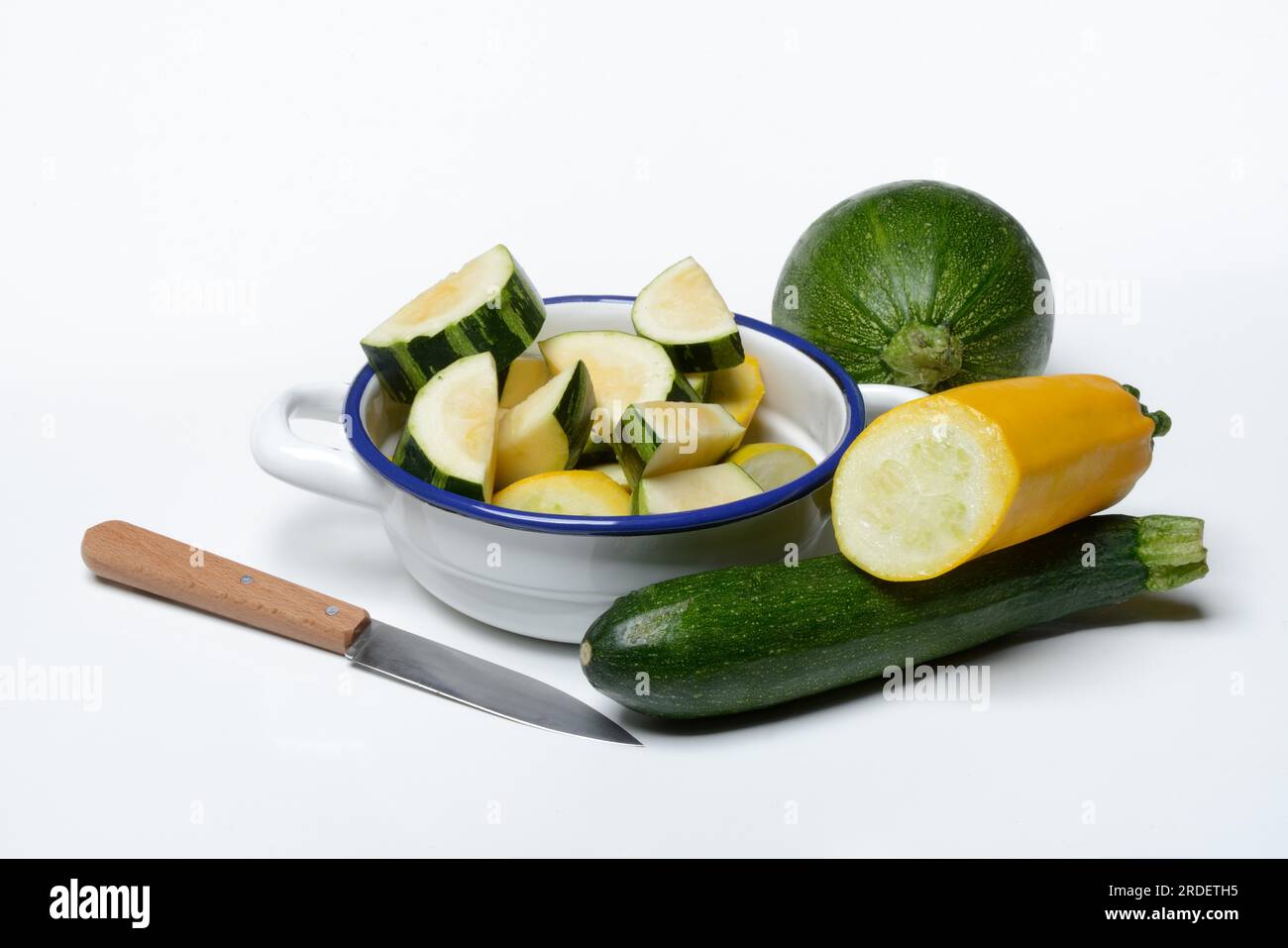 Various courgettes (Cucurbita pepo), courgettes cut up in pot convar ...
