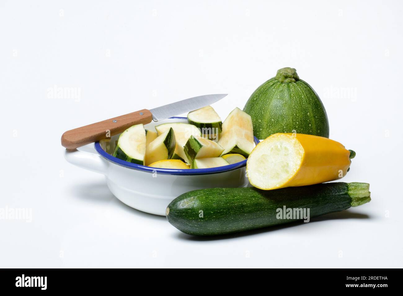 Various courgettes (Cucurbita pepo), courgettes cut up in pot convar ...