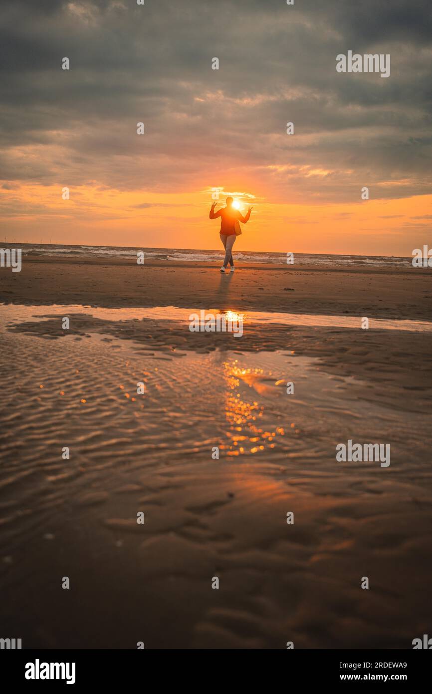 Tourist on the beach at sunset, Zandvoort, Netherlands Stock Photo - Alamy
