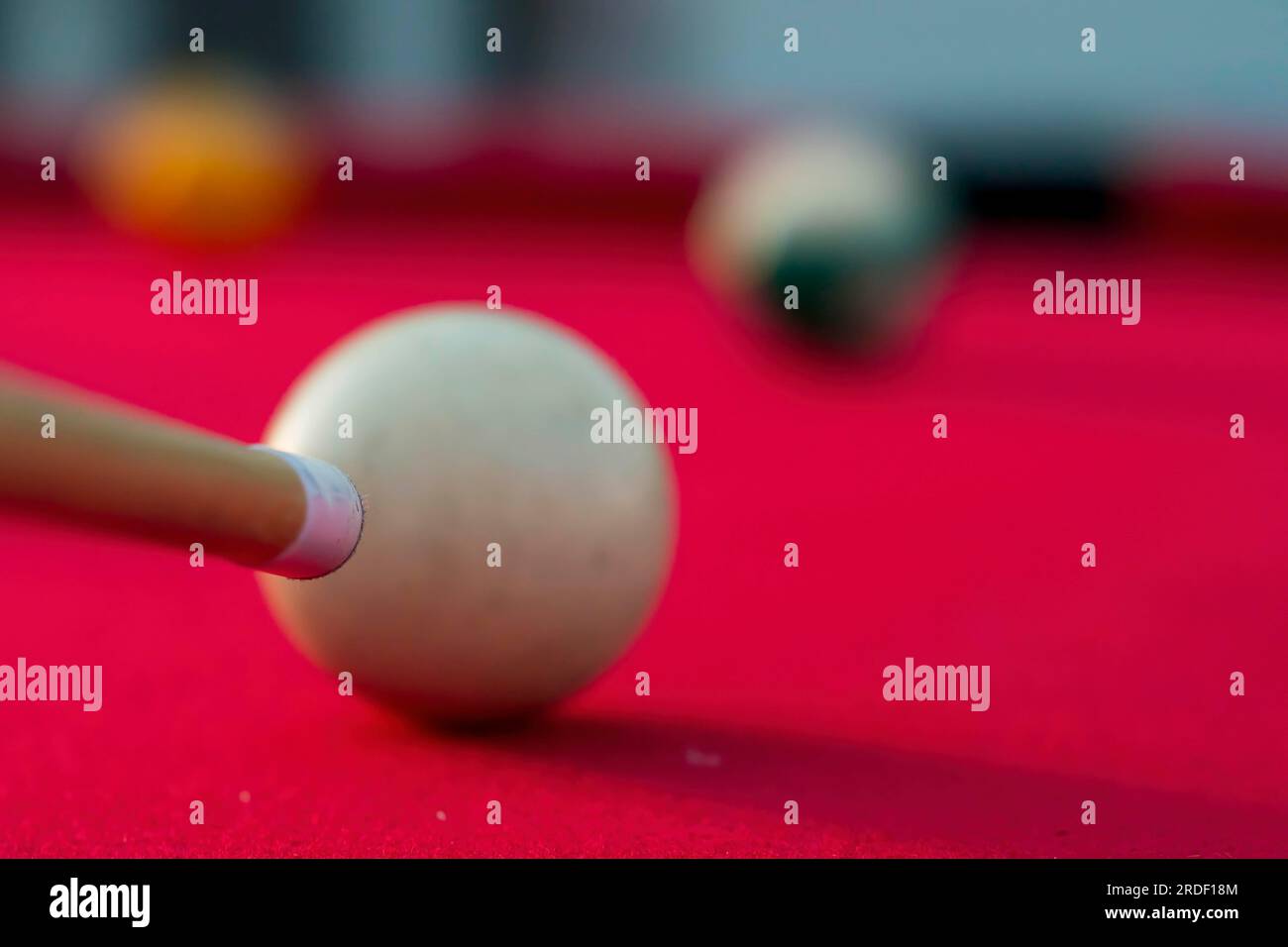 Billiard balls are photographed on fire while sitting outdoors in an ...