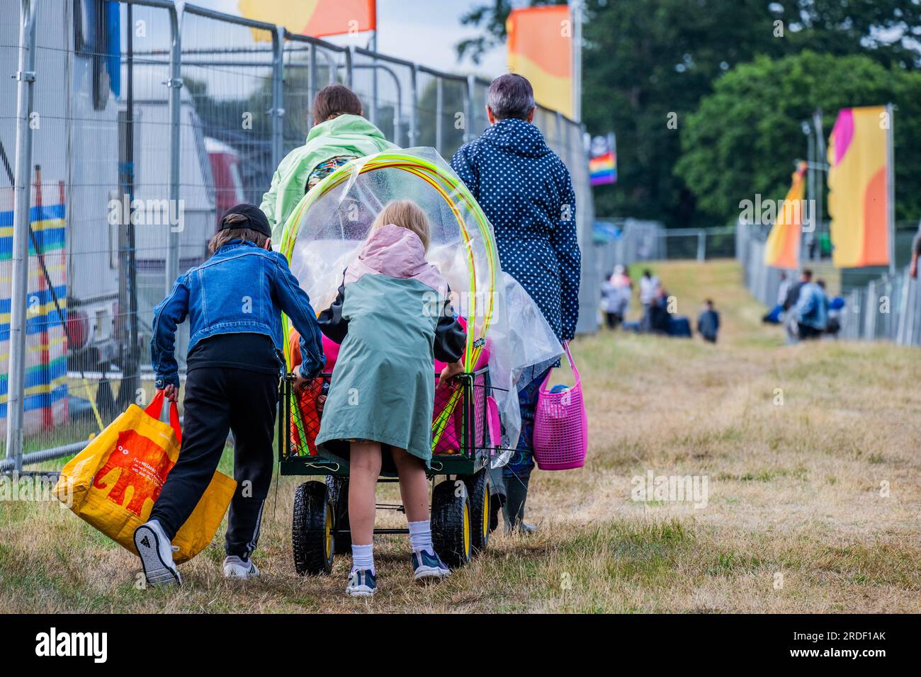 Henham Park, Suffolk, UK. 20th July, 2023. Arrivals in teh rain mean ...