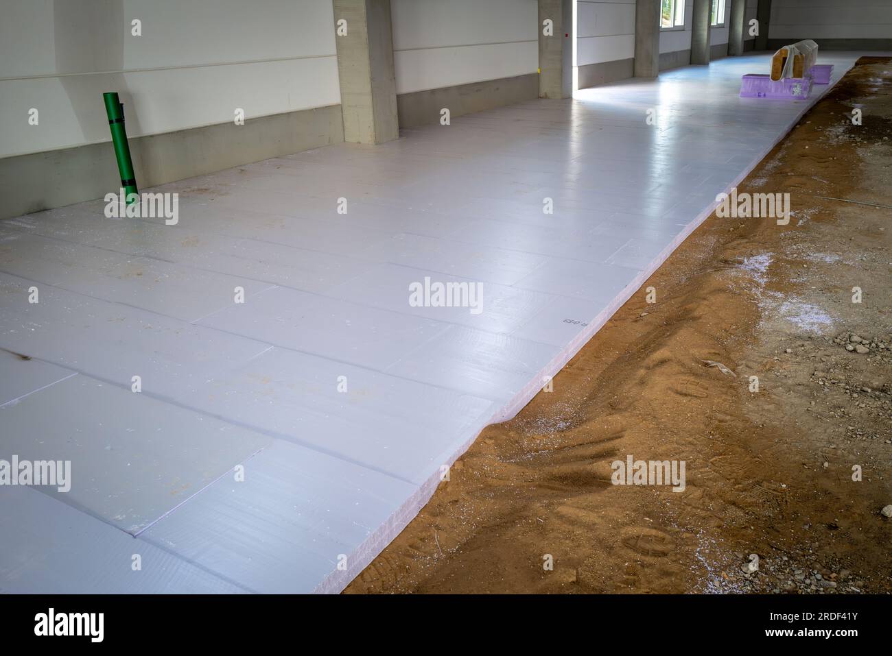 many styrofoam panels are laid on the floor of a newly built factory ...