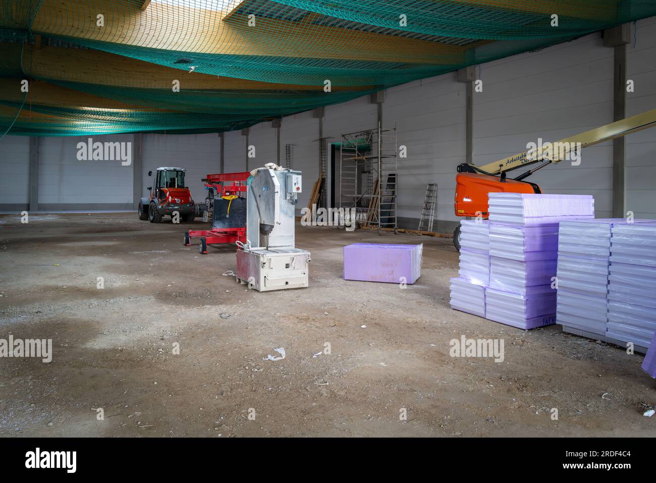 in the newly built factory hall there are styrofoam plates for ...