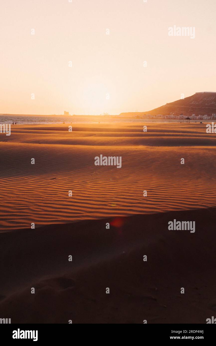 The sunset on a sandy beach in Agadir, Morocco Stock Photo - Alamy