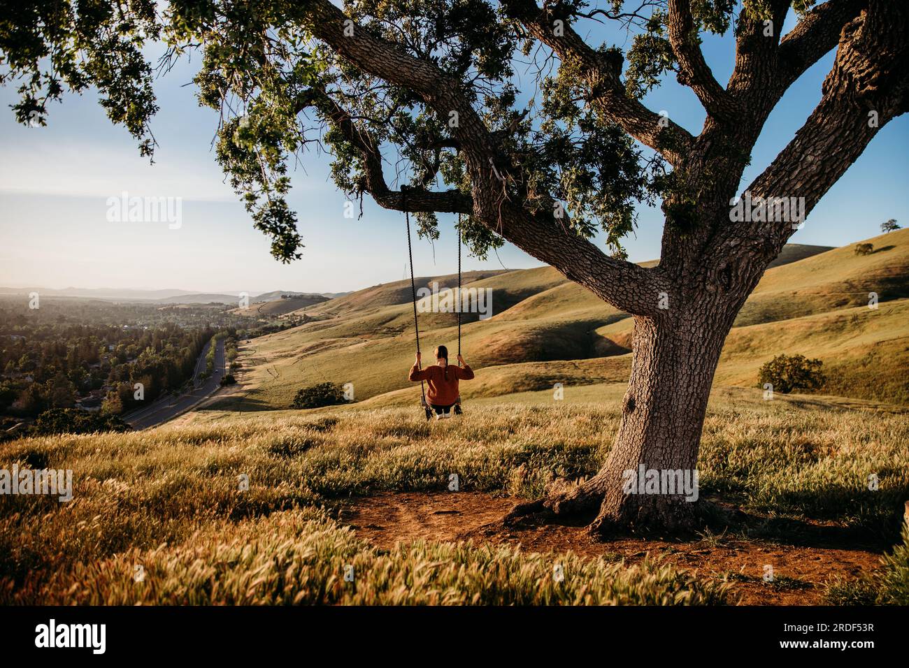 Woman rolling on grass hi-res stock photography and images - Alamy