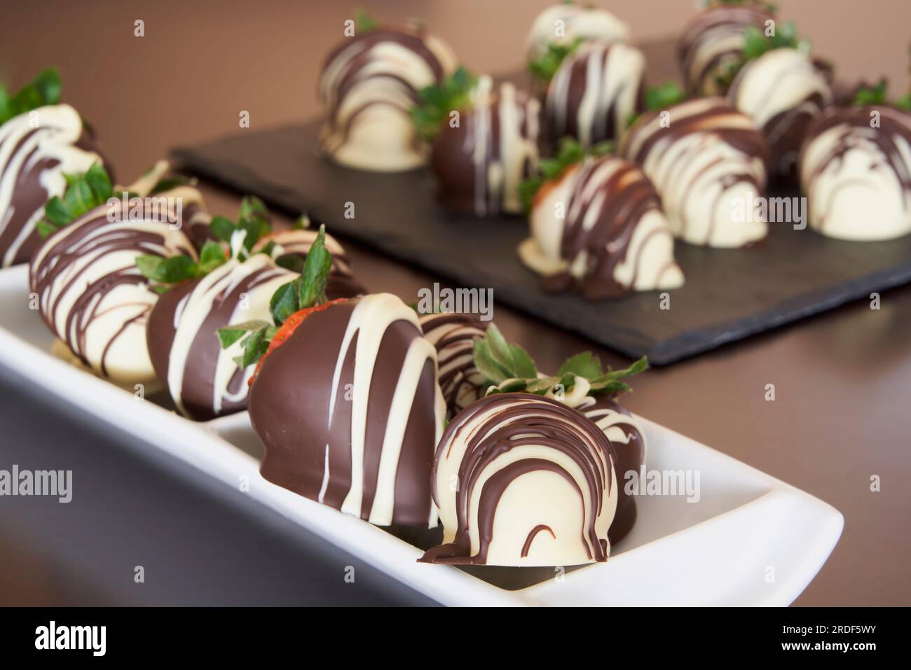 White chocolate cake chocolate dipped strawberries hi-res stock ...