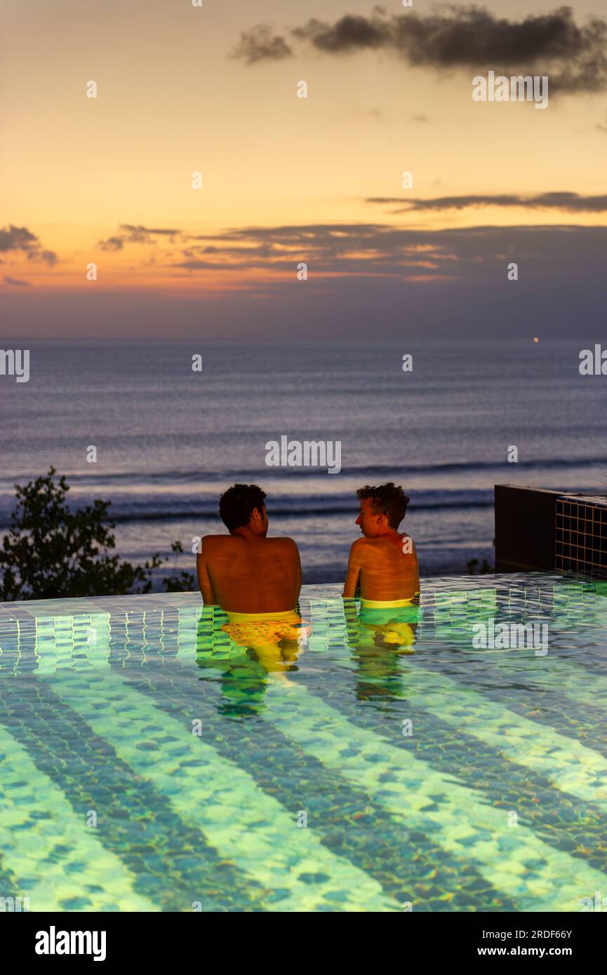 Watching the sunset from an infinity pool, Kuta Beach, Bali, Indonesia ...