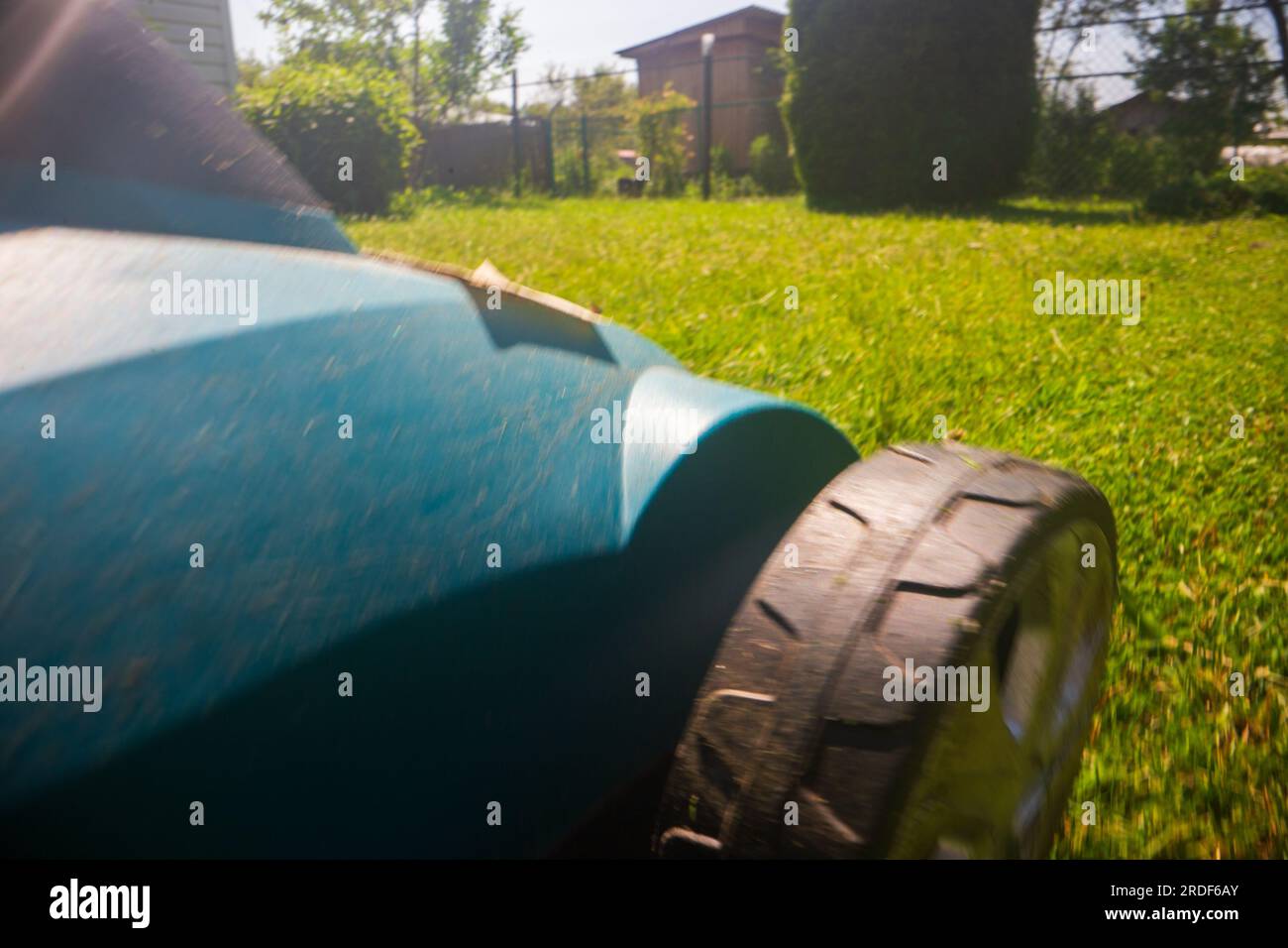 Lawn mover on green grass in modern garden or backyard. Machine for ...