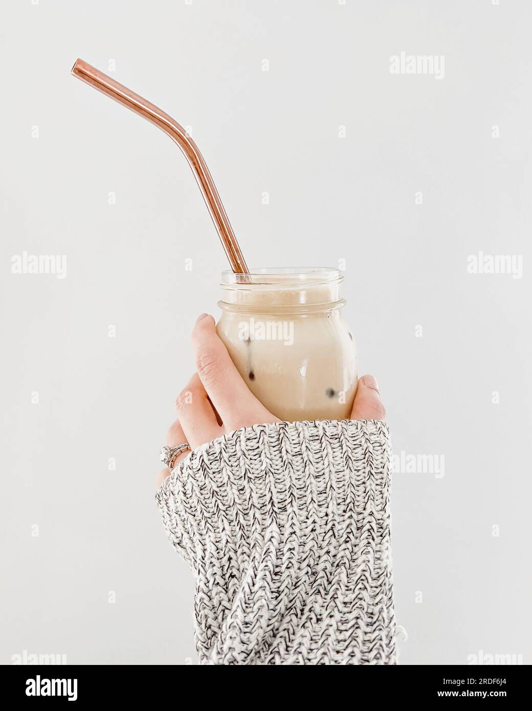 Hand Holding Iced Coffee in Mason Jar with Straw Stock Photo - Alamy