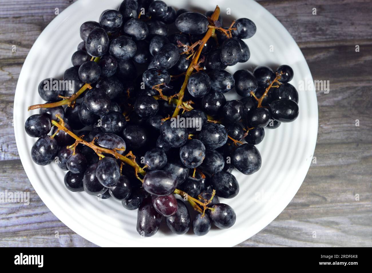Black grapes, a fruit, botanically a berry of the deciduous woody vines ...