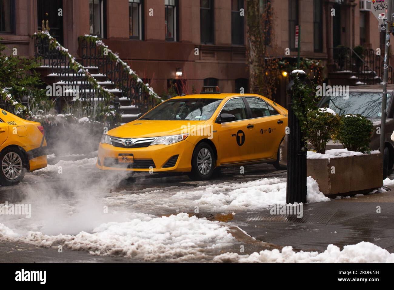 An NYC cab in front of a West Village brownstone around Christmas Stock ...