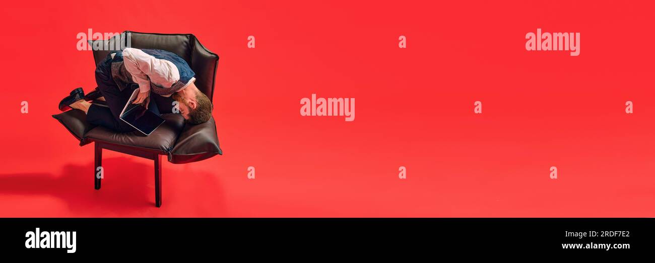 Businessman, employee sitting in weird and uncomfortable position on ...