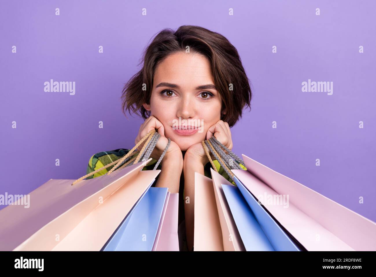 Close up photo portrait of cute nice shopaholic girl holding packages ...