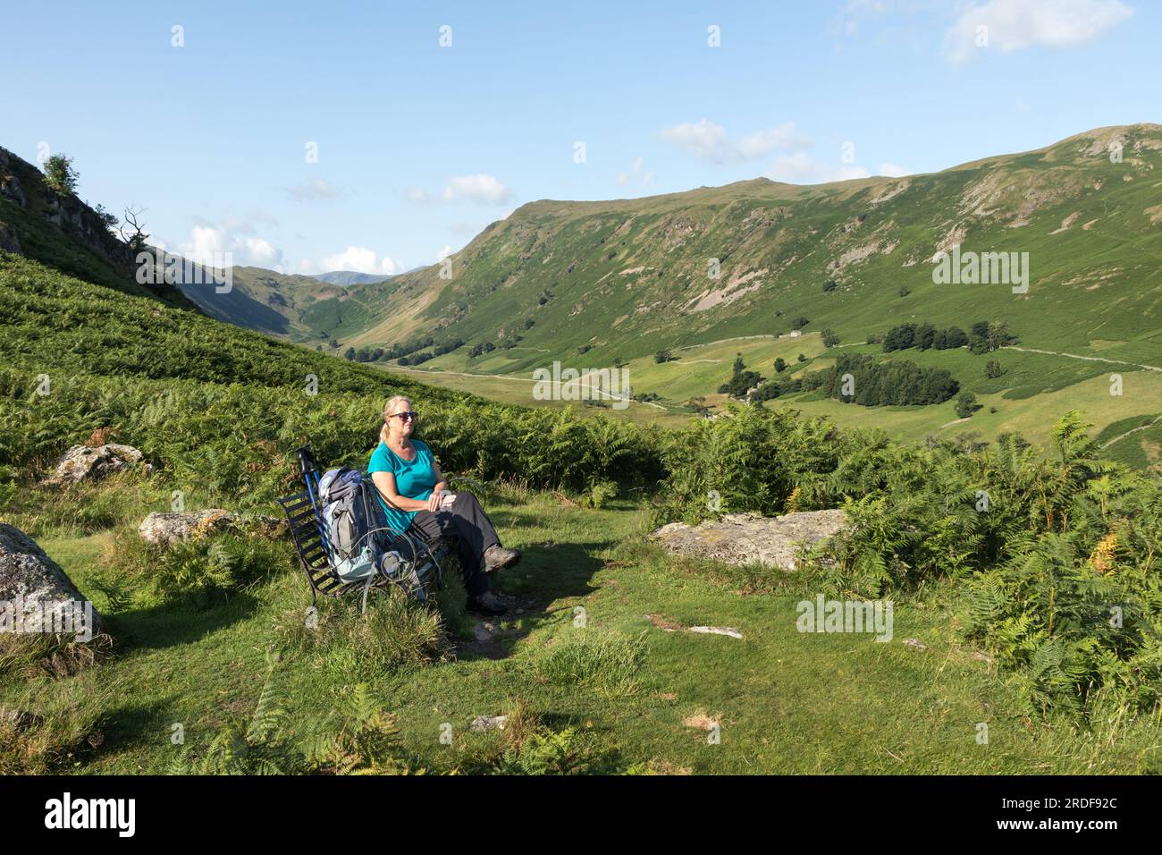 Middle-aged walker enjoying the view from Howstead Brow with the ...