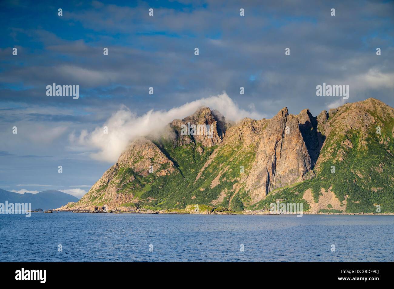 Mountains by the sea, fjord, fishing village Hovden, island Langoya ...