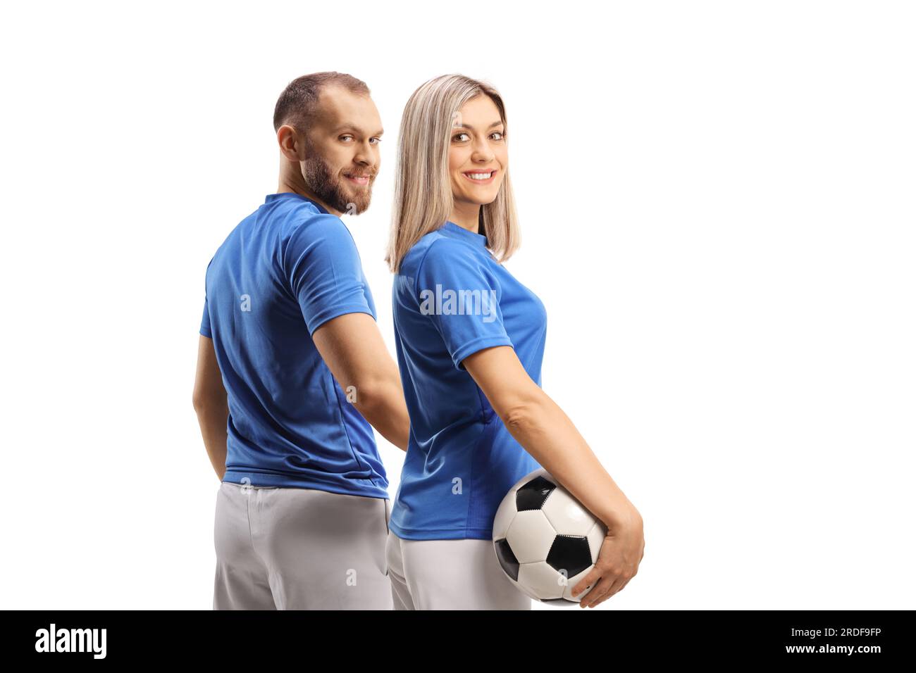Male and female football players turning back to camera isolated on ...