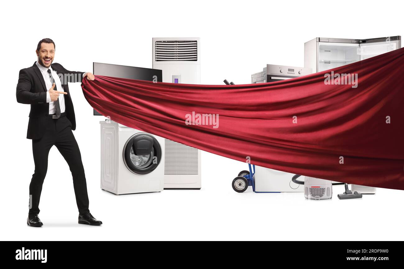 Businessman pulling a red piece of cloth in front of home appliances ...