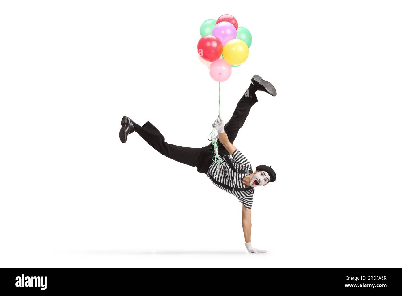 Mime doing a handstand and holding a bunch of balloons isolated on ...
