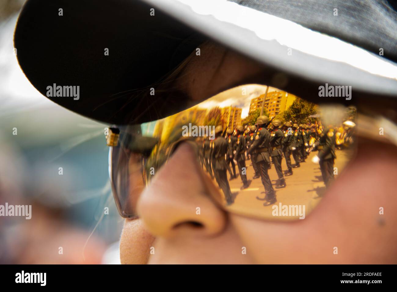 The reflection of the Colomian army official on a women's glasses ...