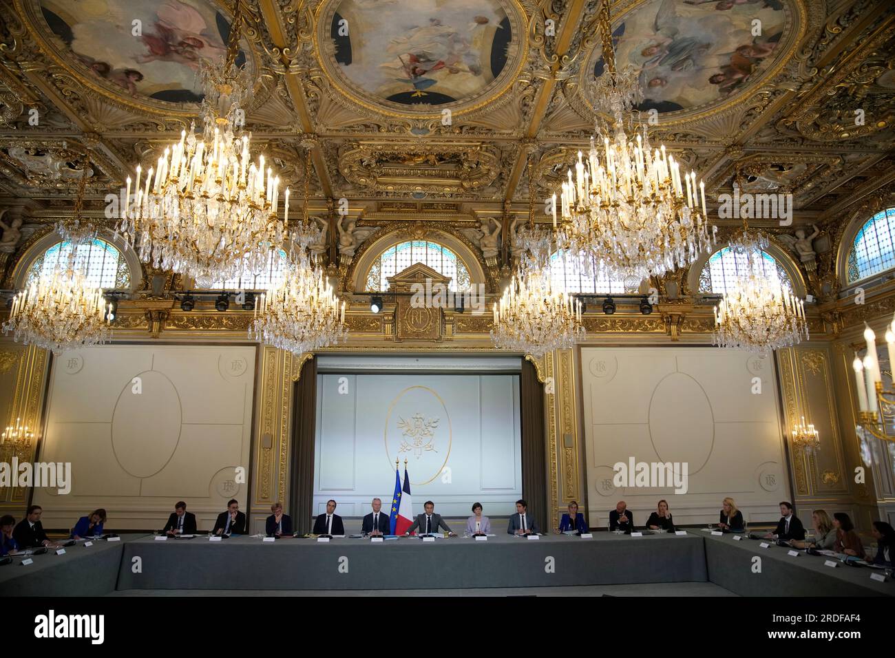French President Emmanuel Macron, center left, speaks as he chairs a ...